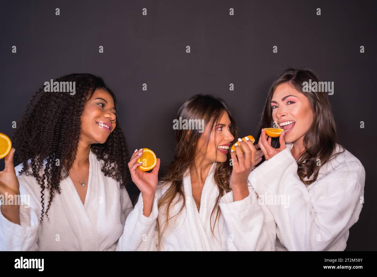 Studio photo with grey background of multi-ethnic relaxed women in ...