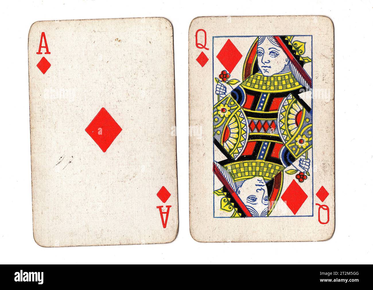 A pair of vintage playing cards showing an ace and queen of diamonds on ...