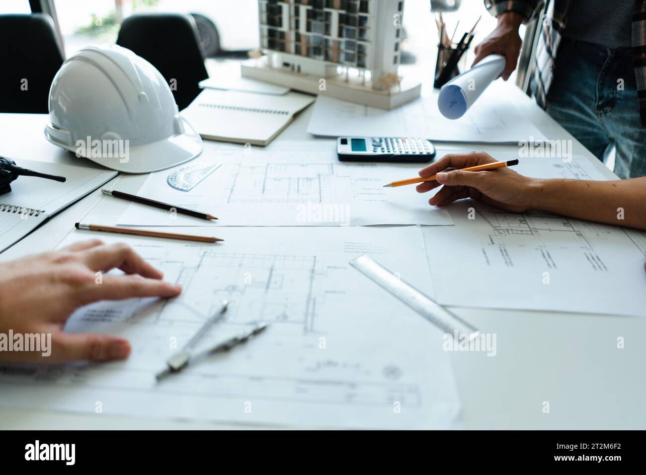 Group of engineer is discussion and brainstorming about blueprint of ...