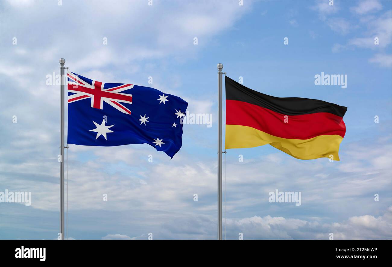 Germany and Australia flags waving together on blue cloudy sky, two ...