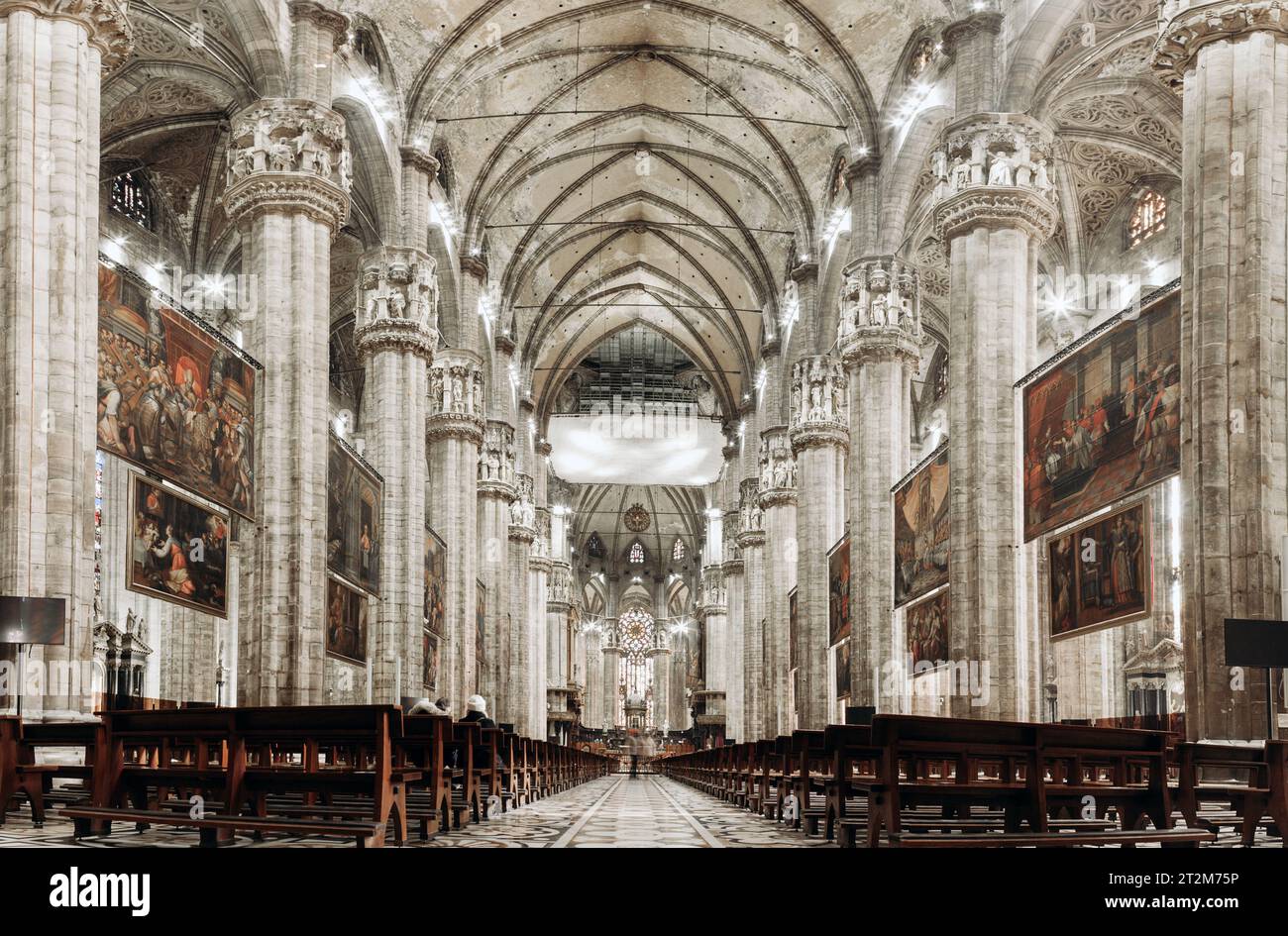 Inside the famous Duomo, the cathedral of Milan city, Italy, also known ...