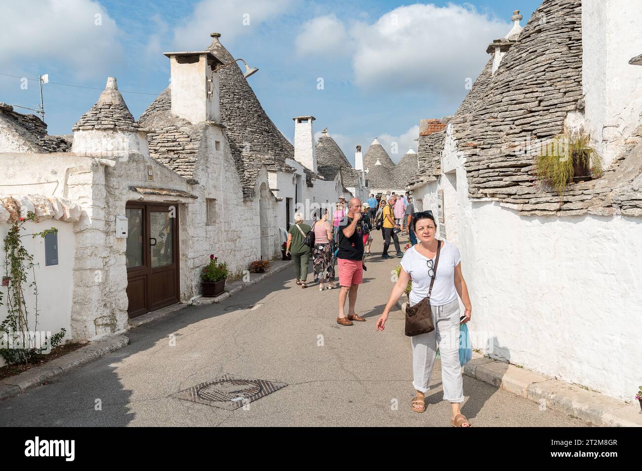 Alberobello, Puglia, Italy - October 5, 2023: Tourists visiting trulli ...