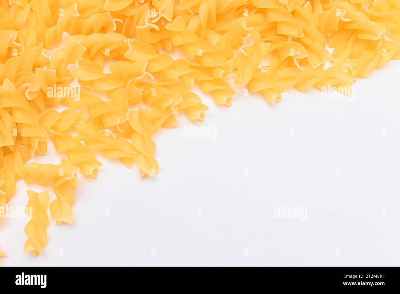 Uncooked Fusilli Pasta with Copy Space on White Background. Raw and Dry ...