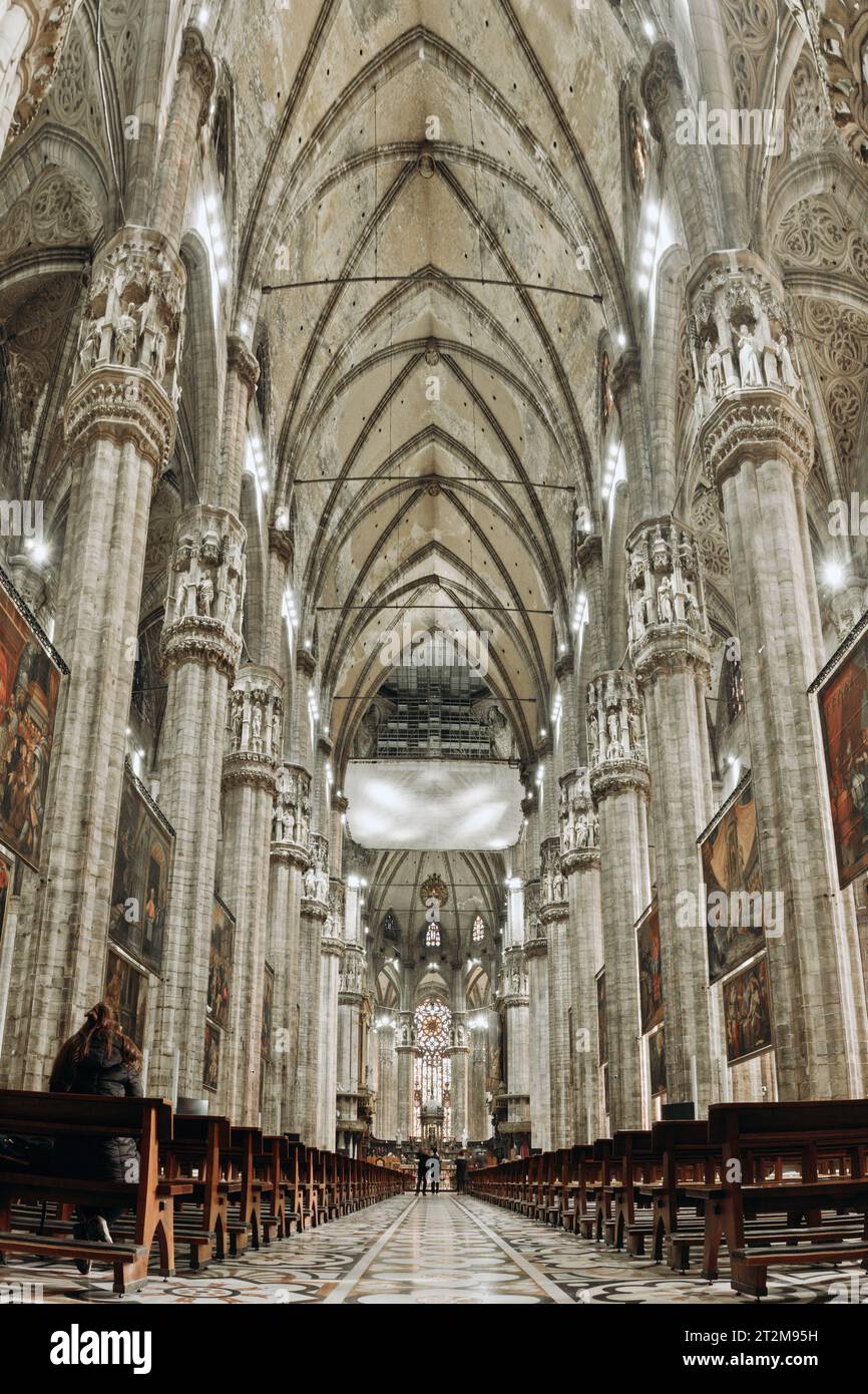 Inside the famous Duomo, the cathedral of Milan city, Italy, also known ...