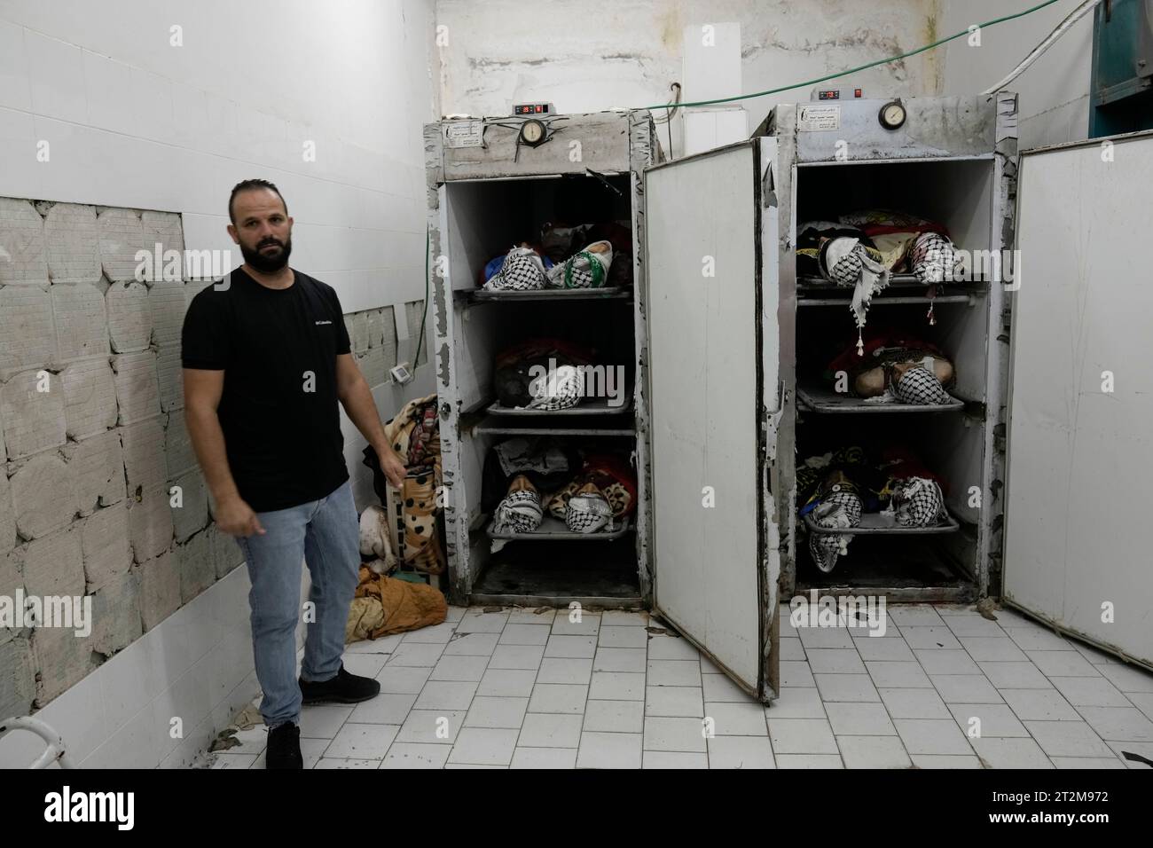 Bodies of Palestinians killed during an Israeli military raid on a ...
