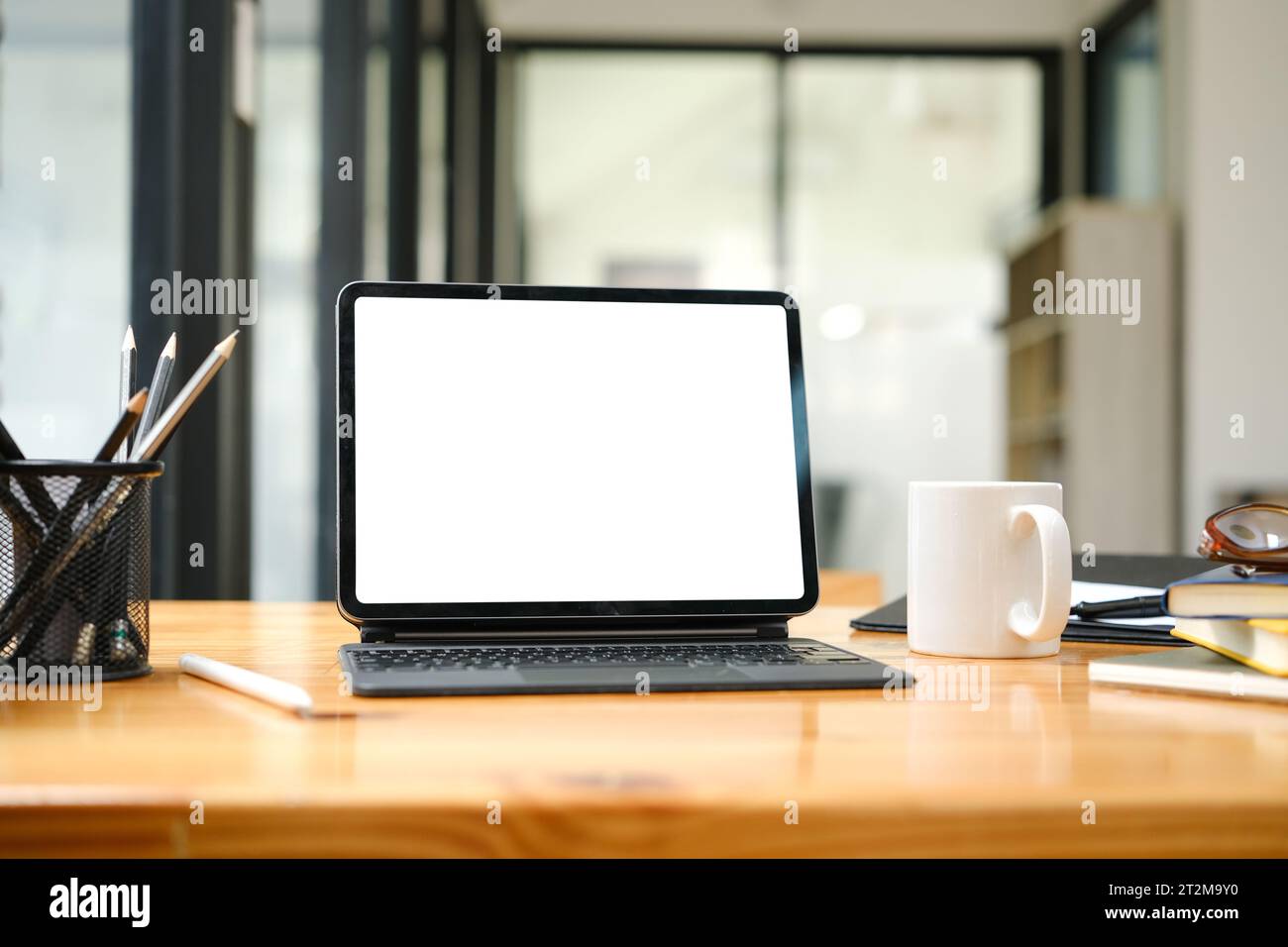Portable computer, blank screen on desk Stock Photo - Alamy