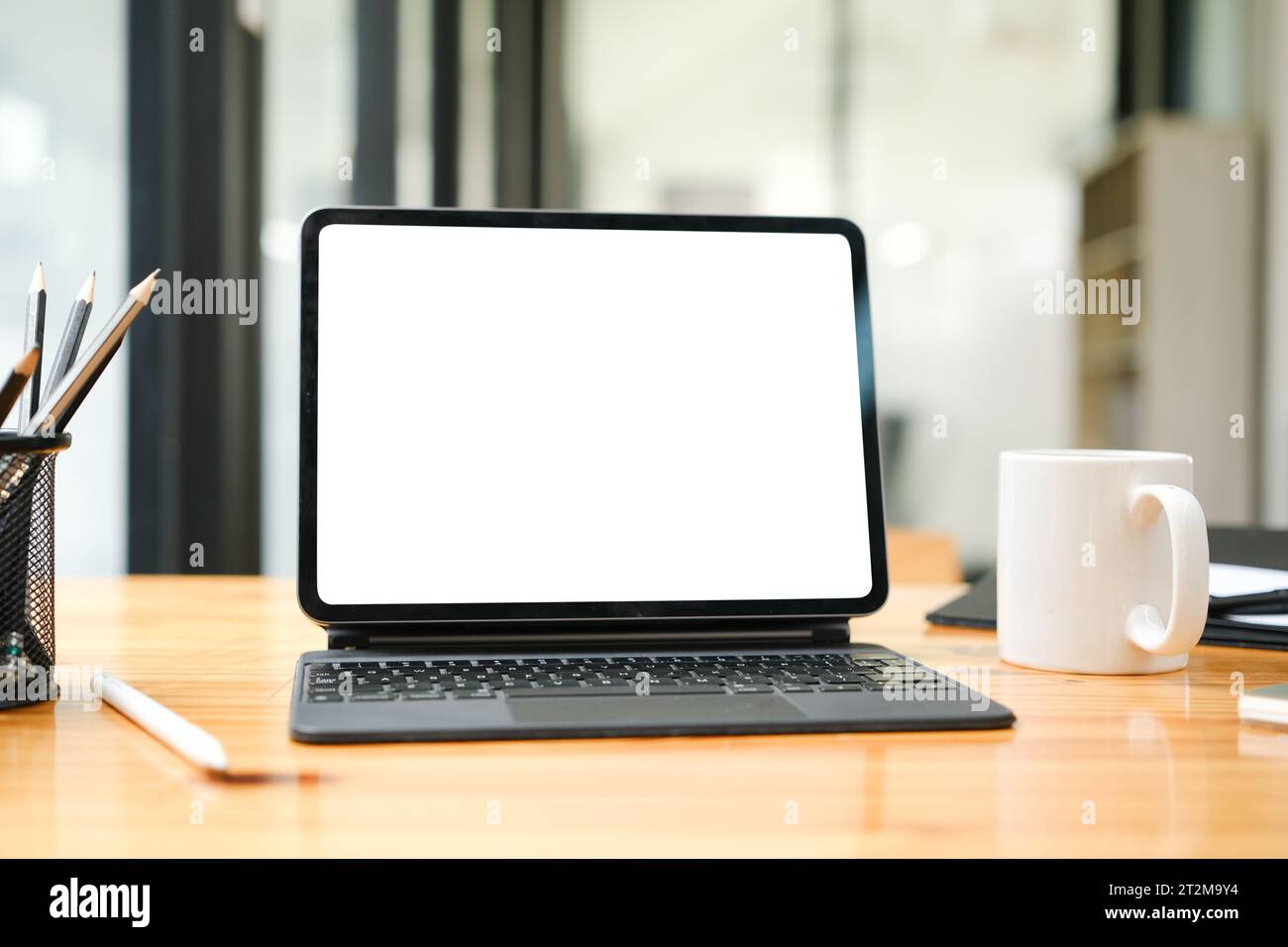 Portable computer, blank screen on desk Stock Photo - Alamy