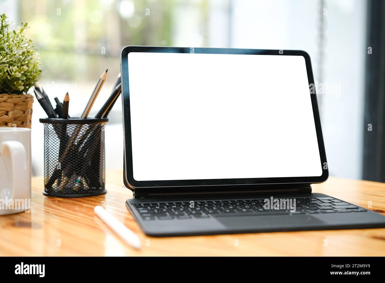 Portable computer, blank screen on desk Stock Photo - Alamy