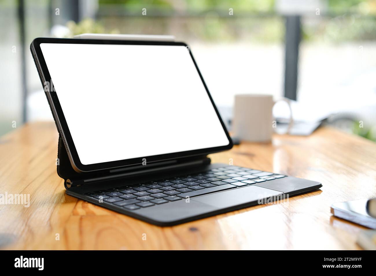 Portable computer, blank screen on desk Stock Photo - Alamy