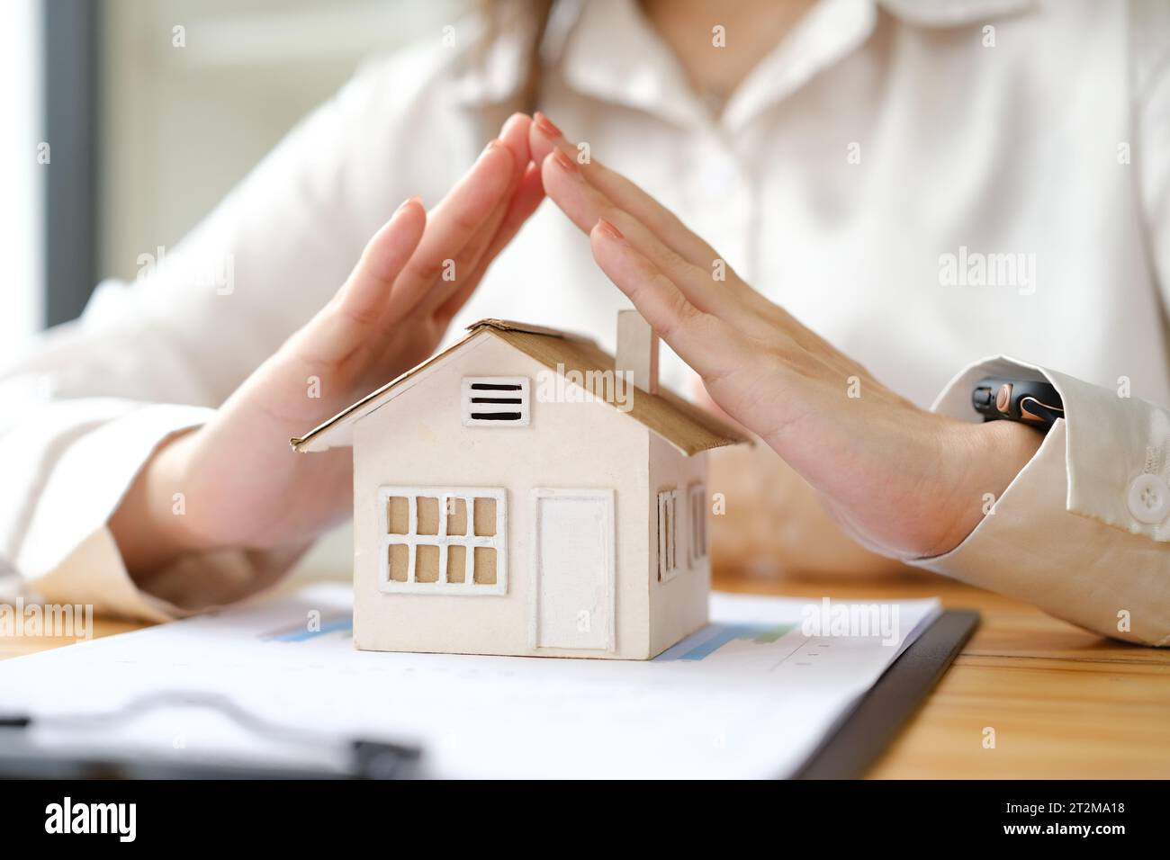 woman showing model of house that she plans to sell concept ai ...