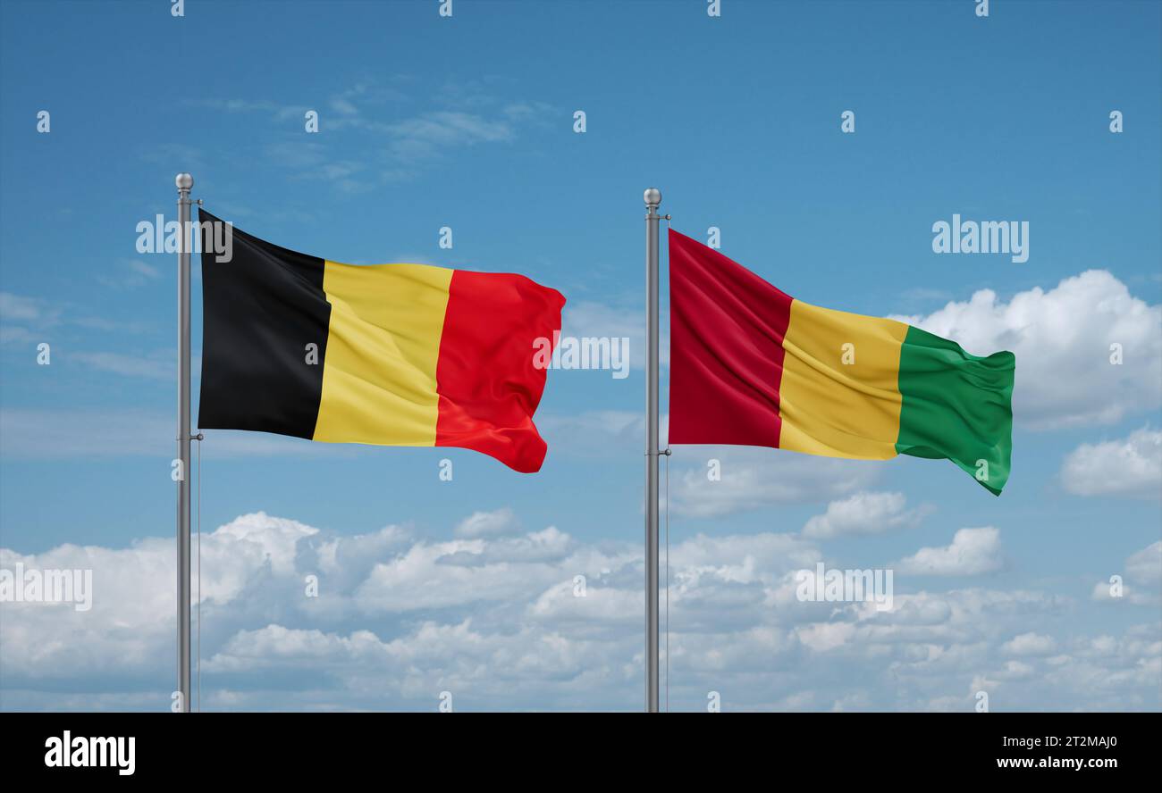 Republic of Guinea and Belgium flags waving together on blue cloudy sky ...