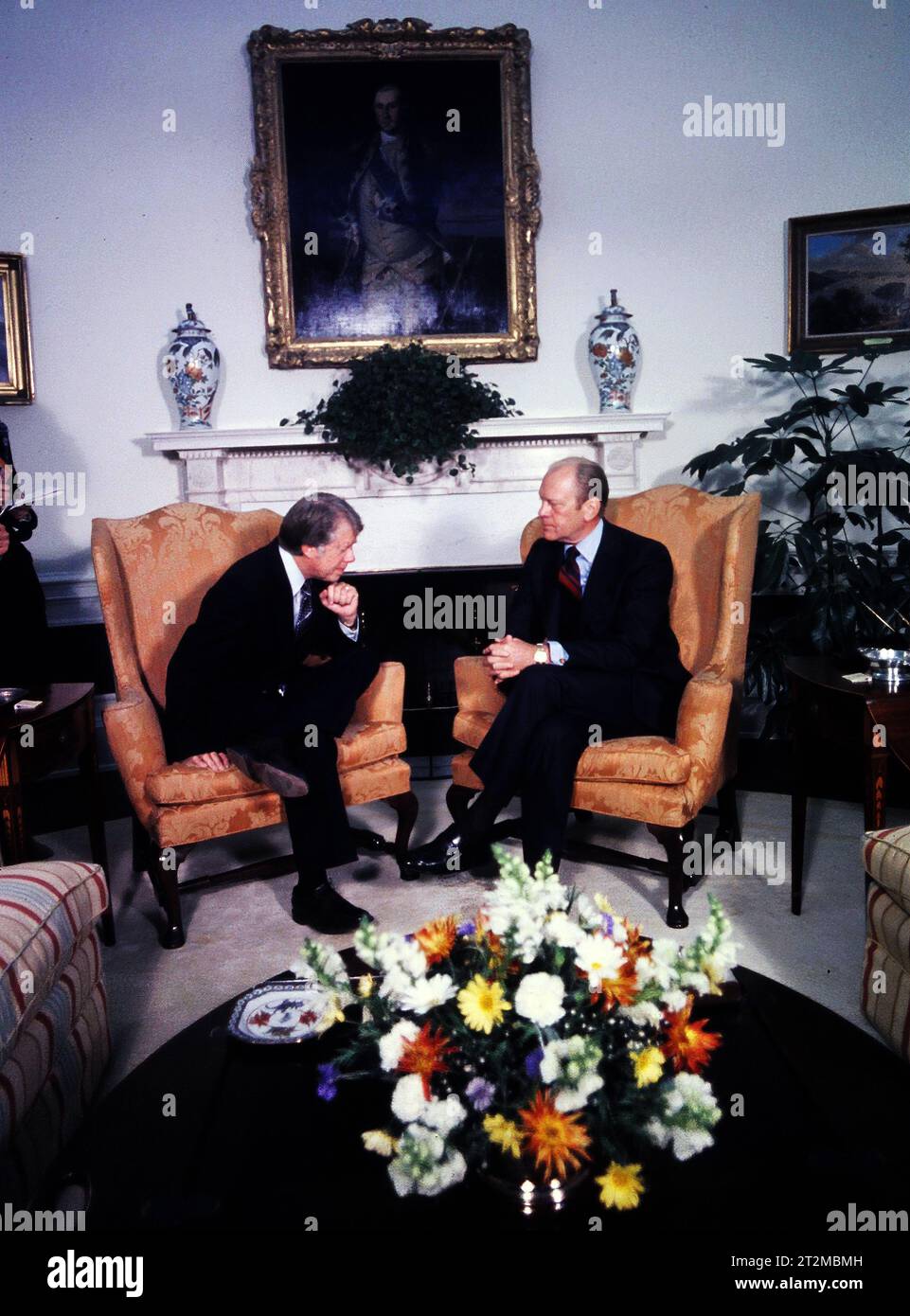 Presient elect Carter meets with President Ford in the Oval Office in ...