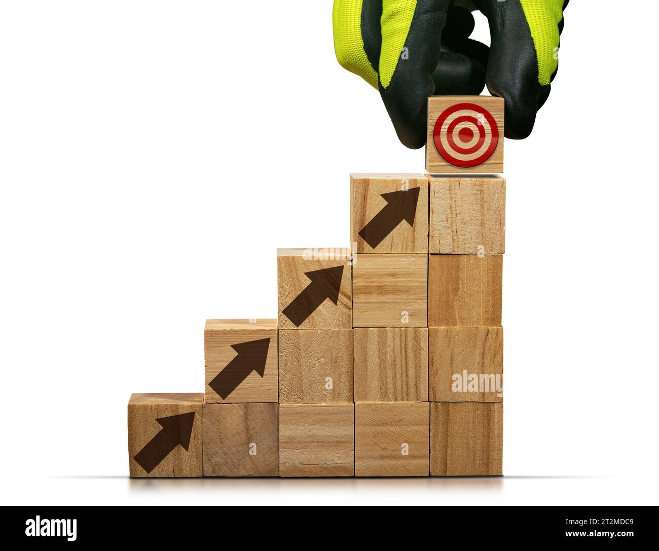 Gloved hand arranging wood blocks as step stair with a target symbol on ...