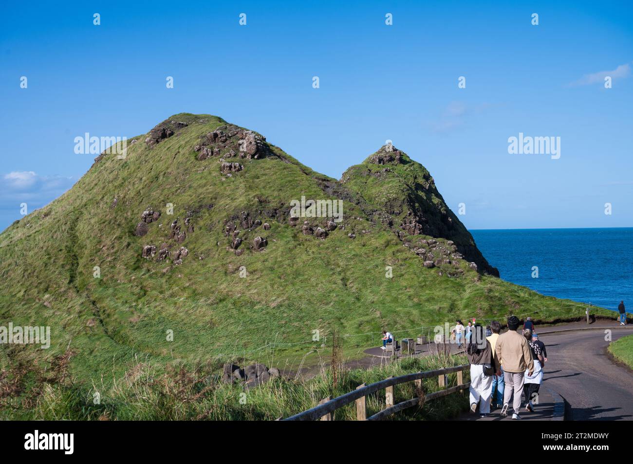 People walking the coastal trail leading to the Giants Causeway. County ...