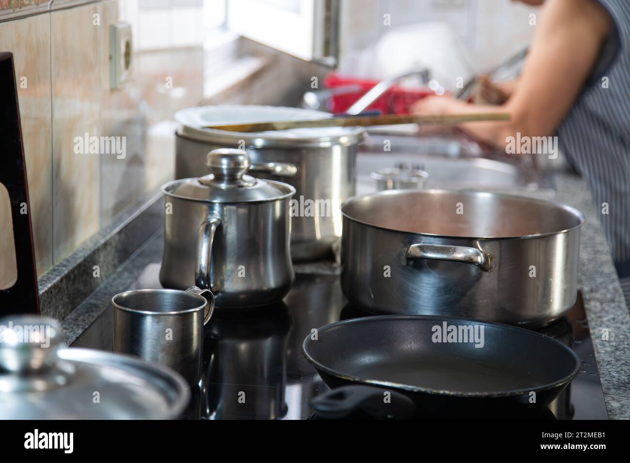 Woman cooking in kitchen with pan. Concept housework, cooking at home ...