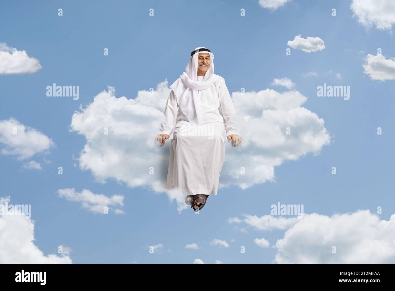 Mature arab man in ethnic clothes sitting on a cloud up in the sky ...