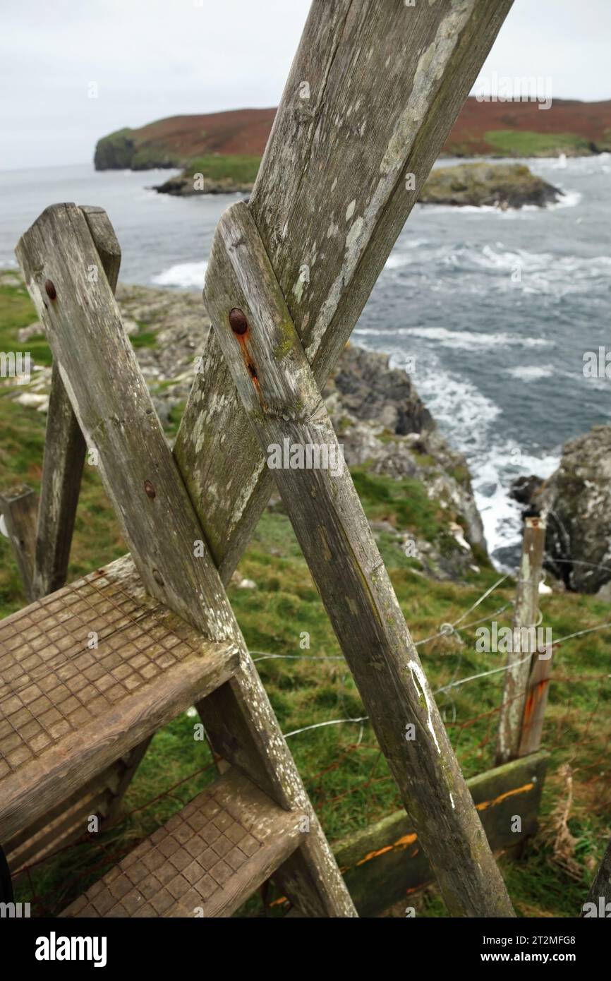 Wooden ladder stile for public footpath overlooking the Calf Sound and ...
