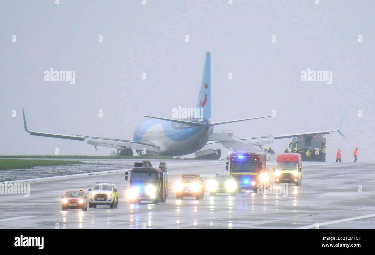 Emergency services at the scene after a passenger plane came off the ...