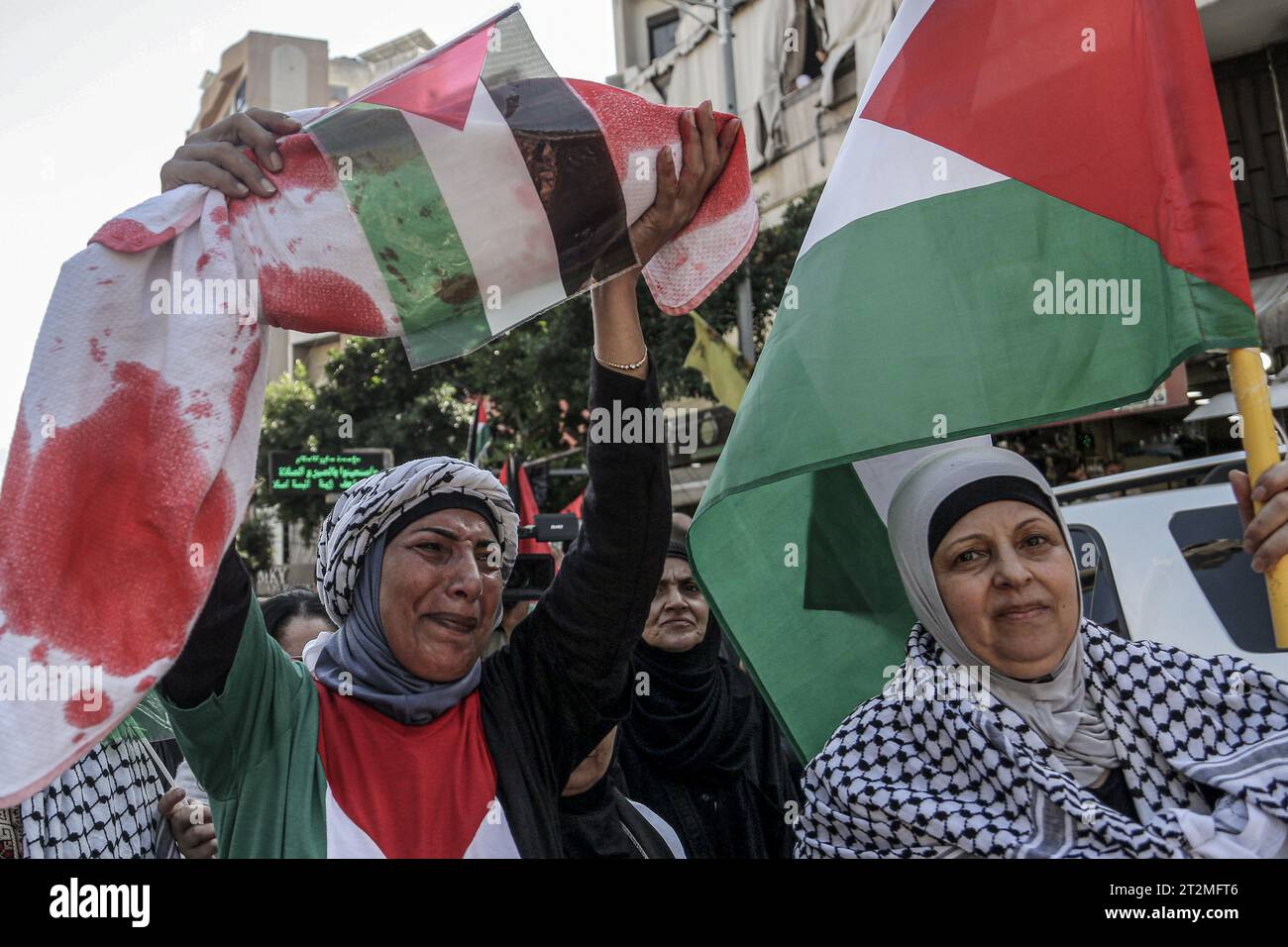 Beirut, Lebanon. 20th Oct, 2023. A Palestinian woman raises a mock body ...