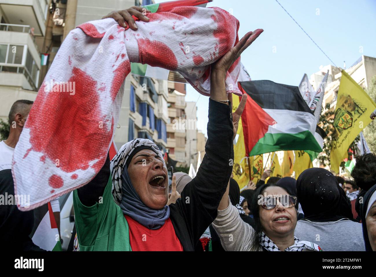 Beirut, Lebanon. 20th Oct, 2023. A Palestinian woman raises a mock body ...
