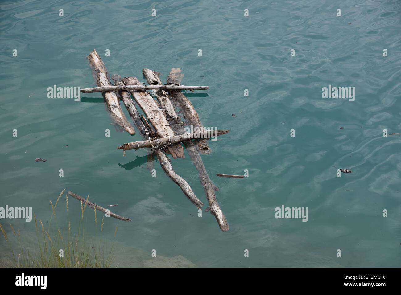Ramshackle Wooden Raft or Makeshift Raft Adrift or Floating on Lake ...