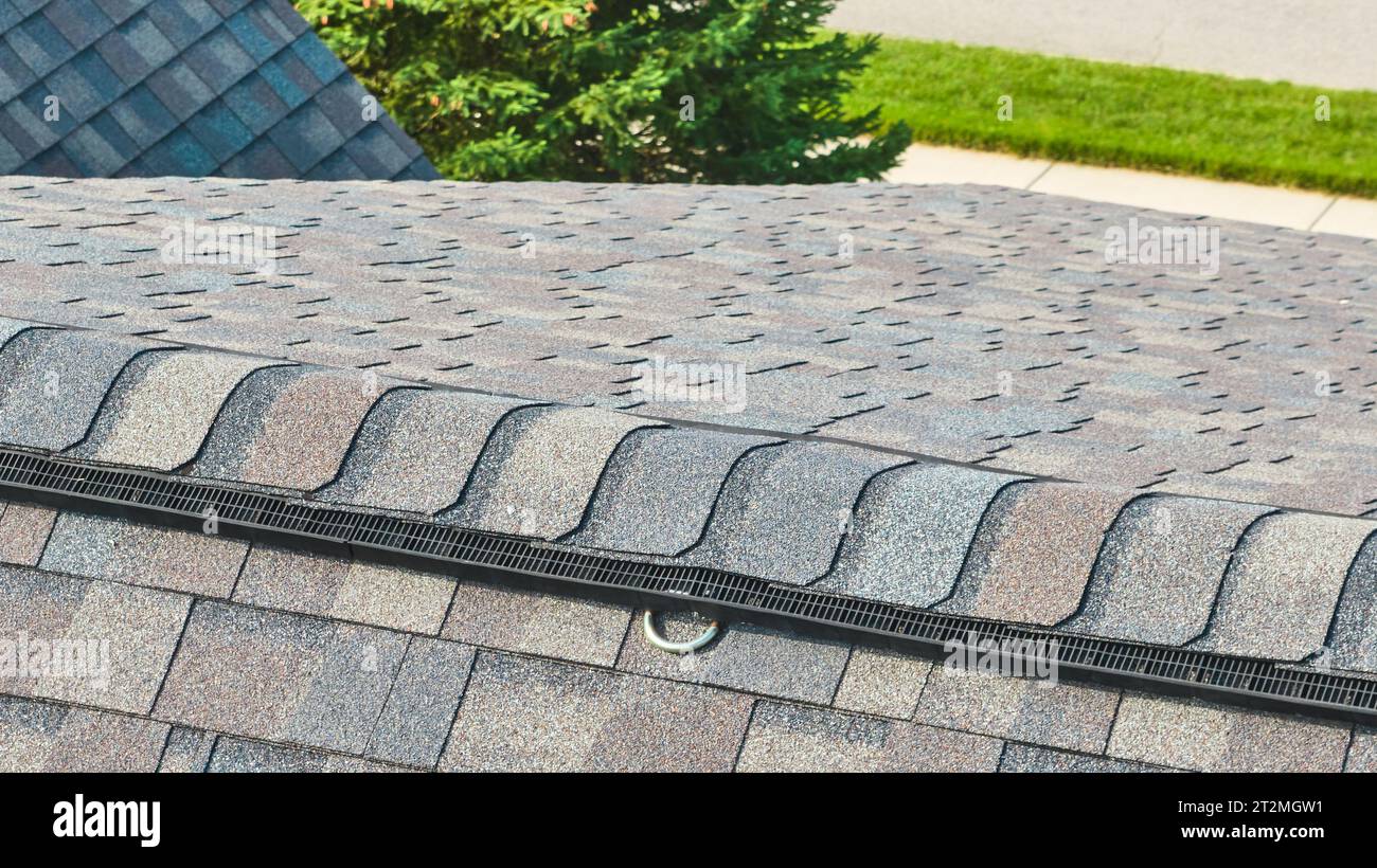Aerial close up of roof anchor ring on roof with brown and gray ...