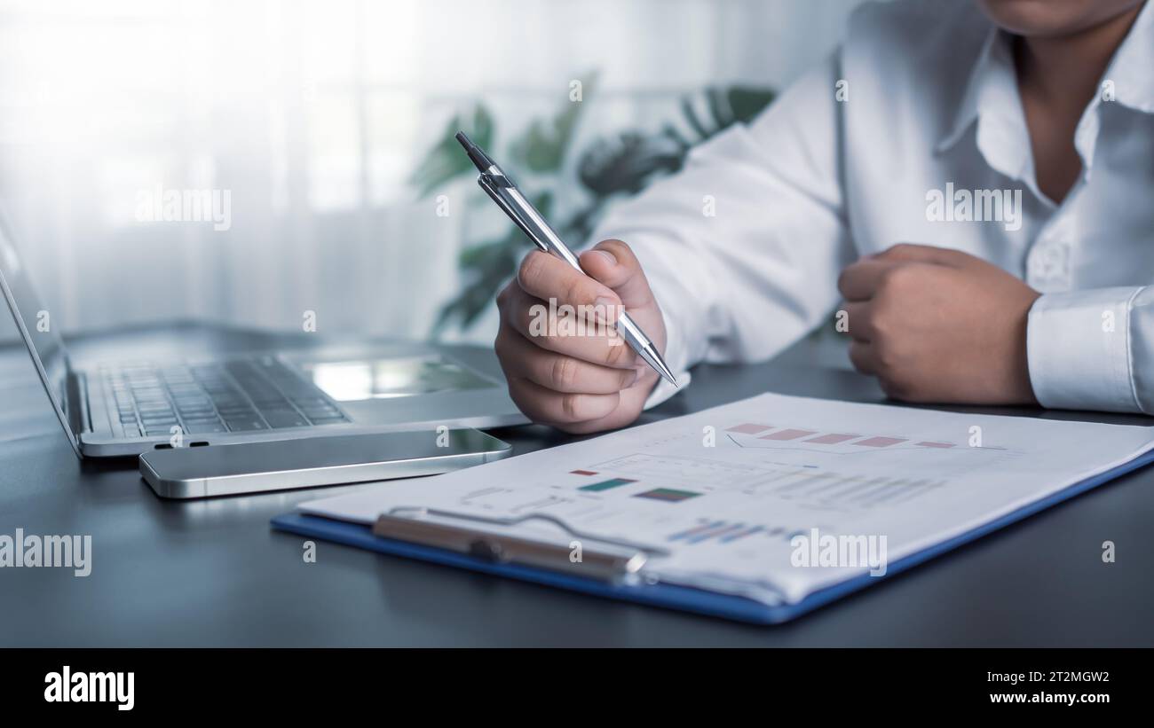 Business people use computers to analyze business and manage corporate ...