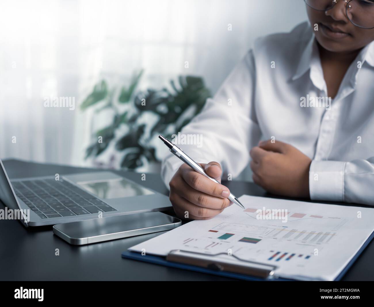 Business people use computers to analyze business and manage corporate ...