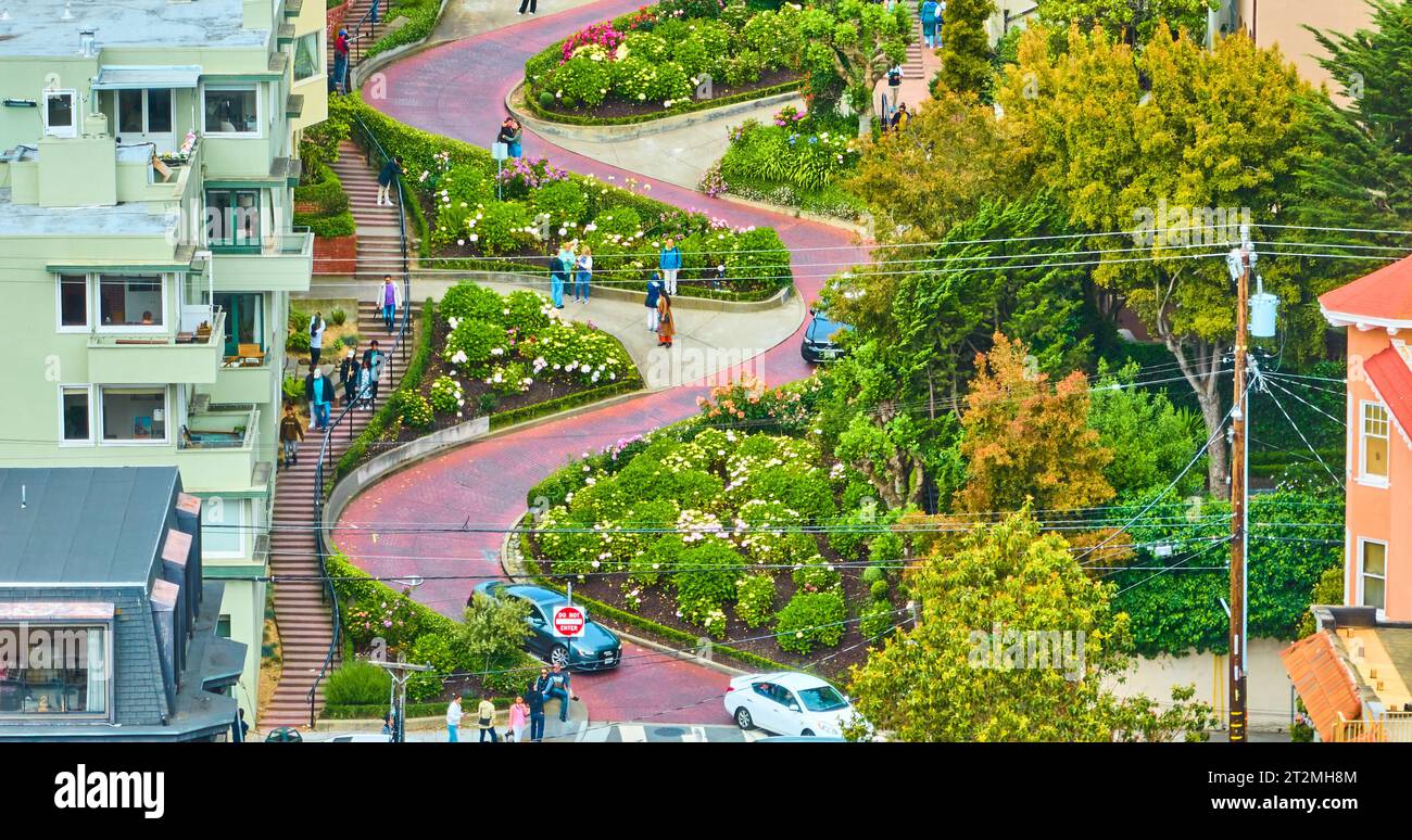 Aerial people and cars navigating Lombard Street zoomed in view of ...