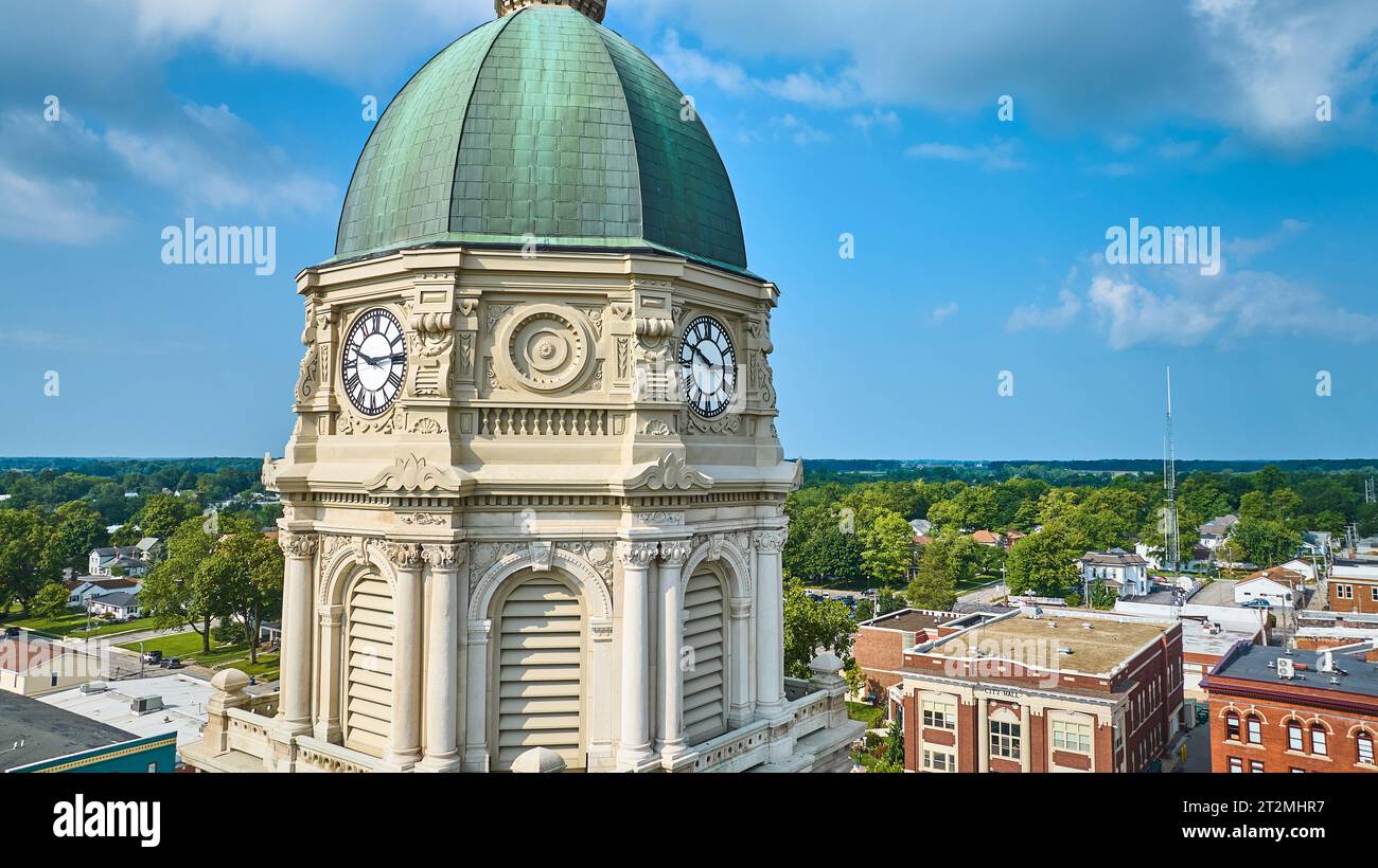 Close up of Columbia City courthouse clock tower with dome and blue sky ...