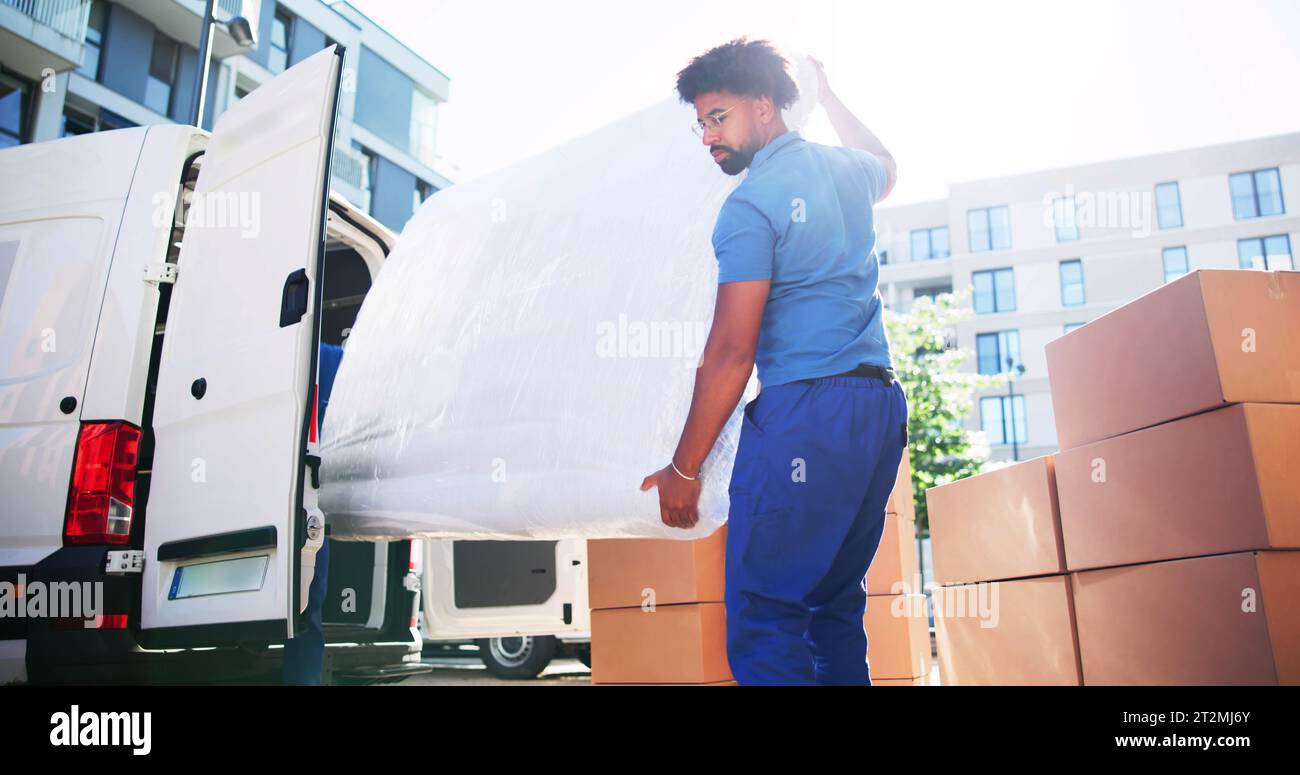 Mattress Move And Delivery Using Mover Truck Furniture Transport Stock