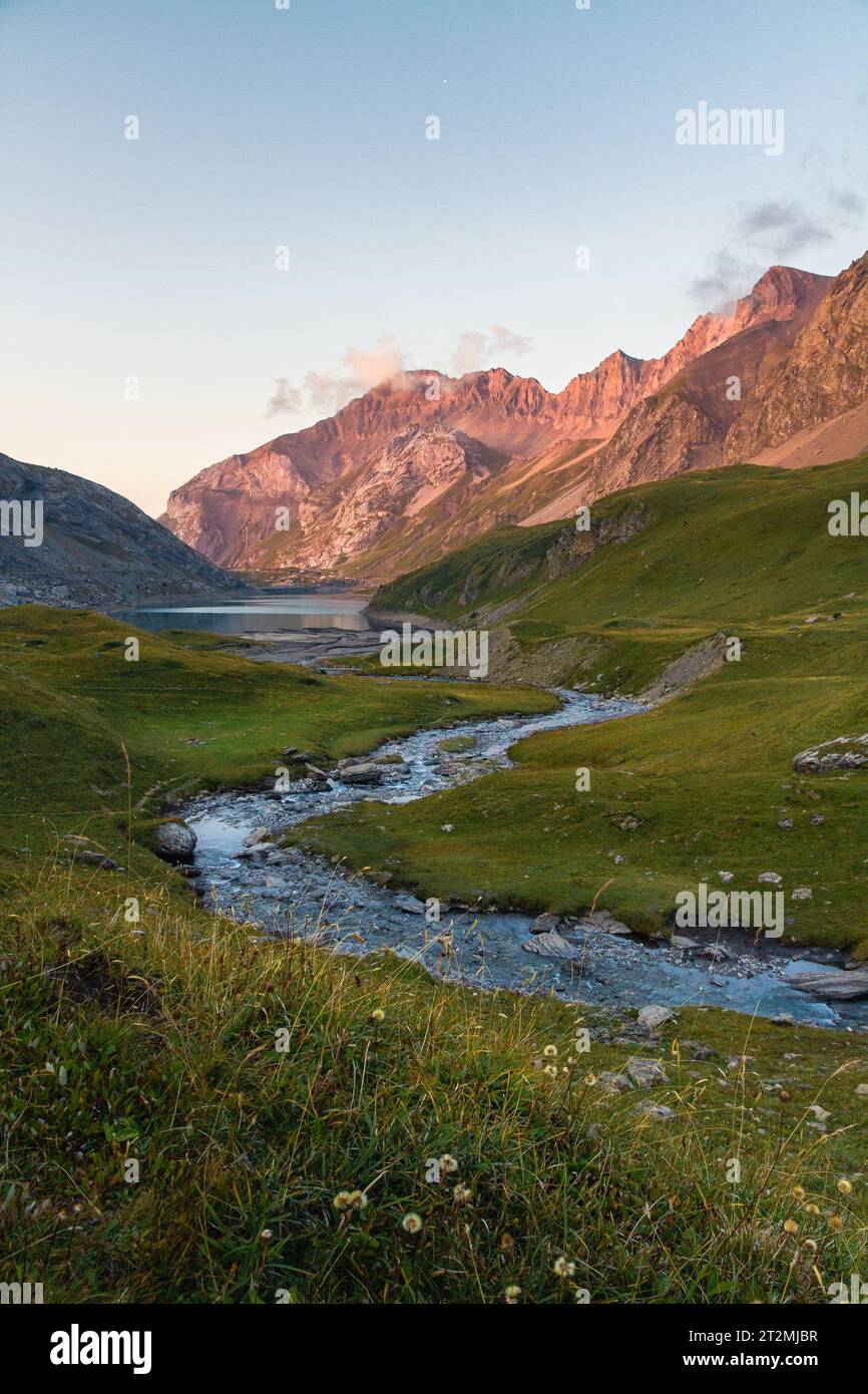 Landscape summer view of the Col du Sanetsch at sunset with a river ...