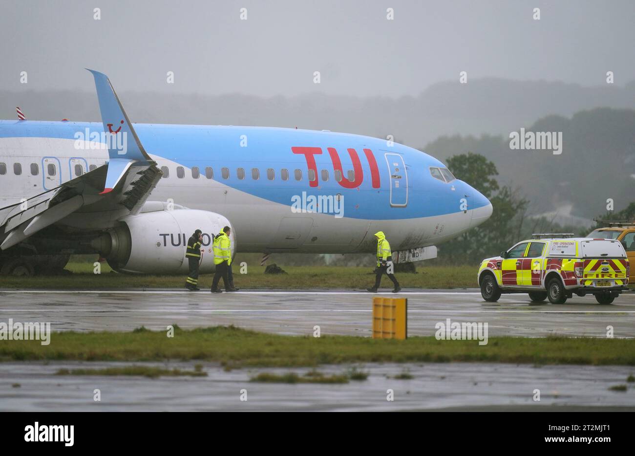 Emergency services at the scene after a passenger plane came off the ...
