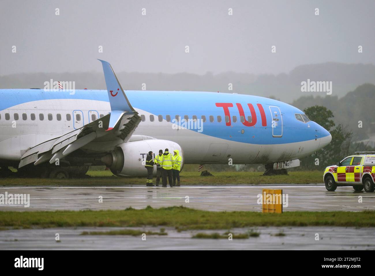 Emergency services at the scene after a passenger plane came off the ...