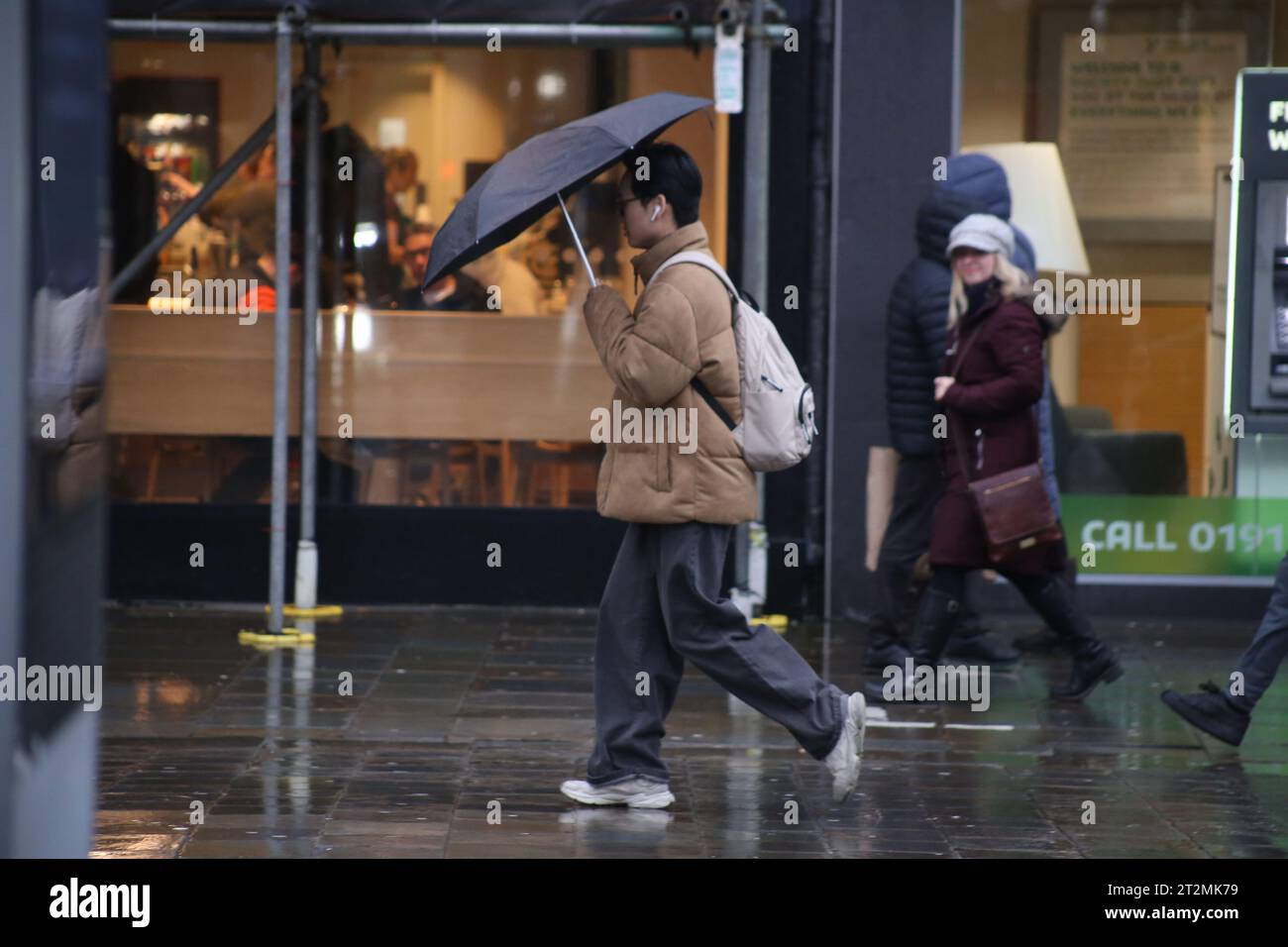 Newcastle, UK. 20th Oct 2023. Storm Babet - People battle the weather ...