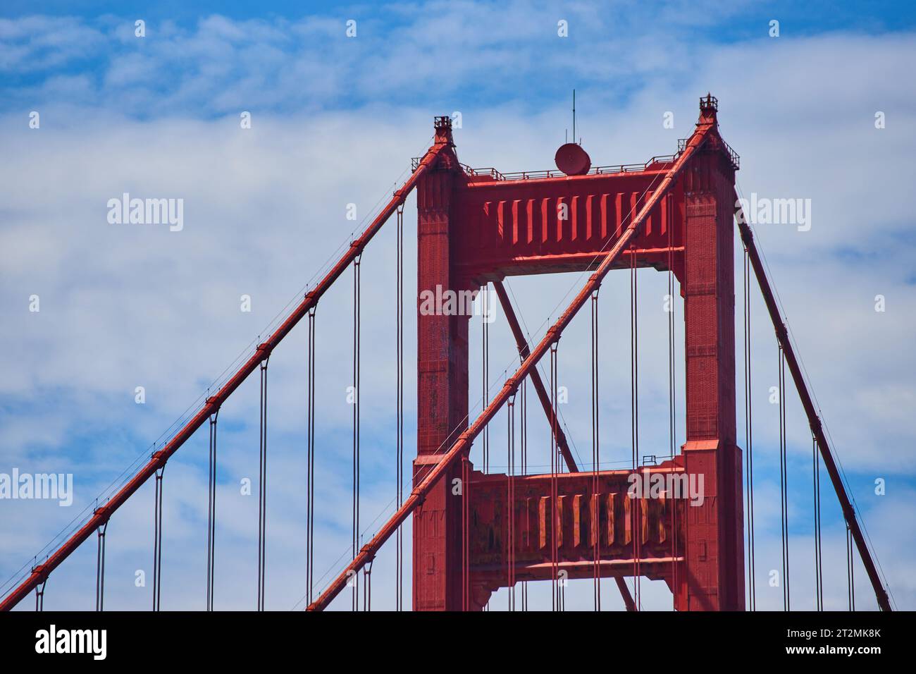Top of Golden Gate Bridge zoom shot with cloudy blue sky Stock Photo ...