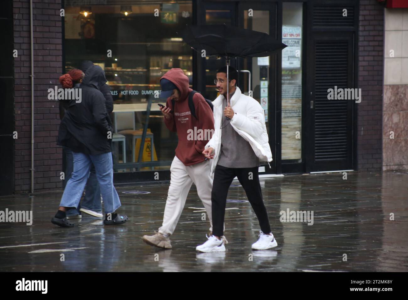Newcastle, UK. 20th Oct 2023. Storm Babet - People battle the weather ...