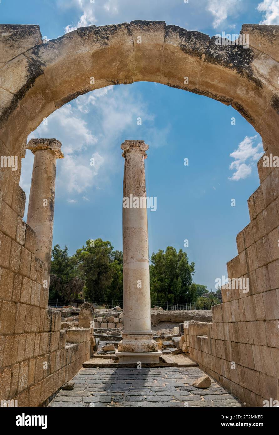 Beit Shean, Israel - August 13, 2023: Ruins of Roman arch with a column in the center at Beit ...