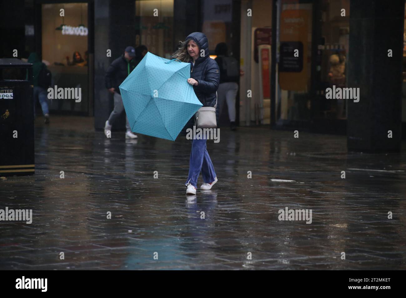 Newcastle, UK. 20th Oct 2023. Storm Babet - People battle the weather ...