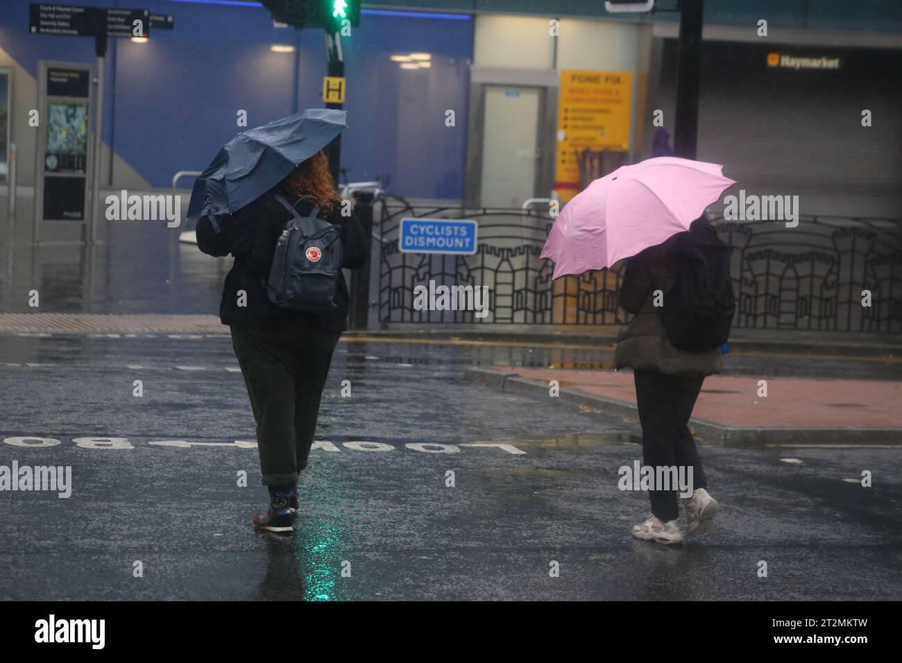 Newcastle, UK. 20th Oct 2023. Storm Babet - People battle the weather ...