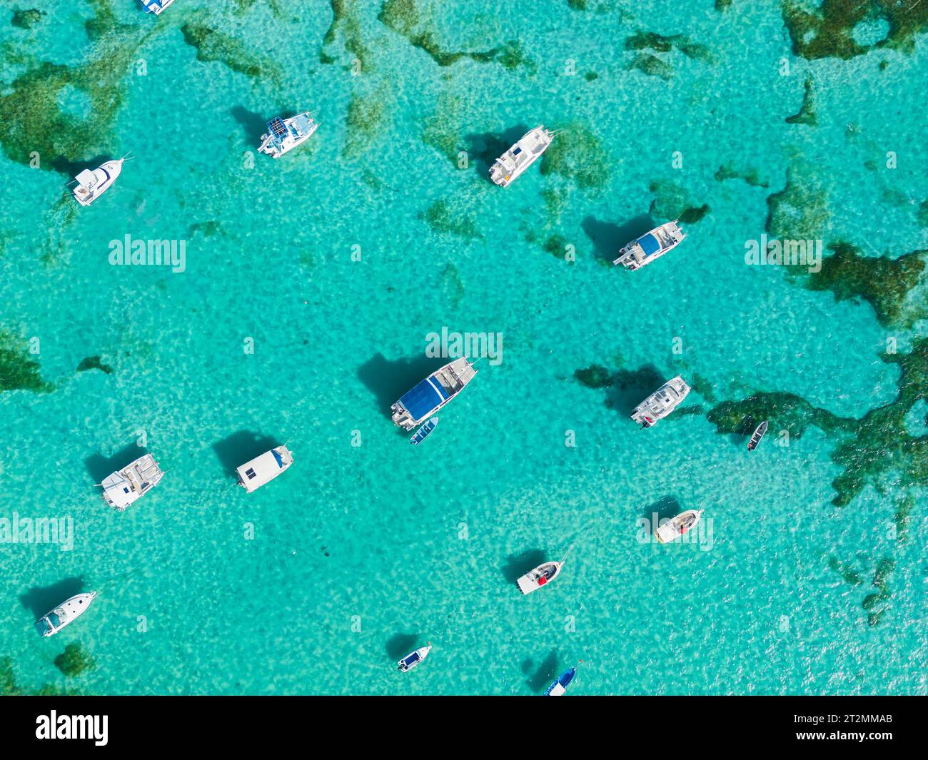 Aerial top view of many anchoring yachts and tourist boats in the ...