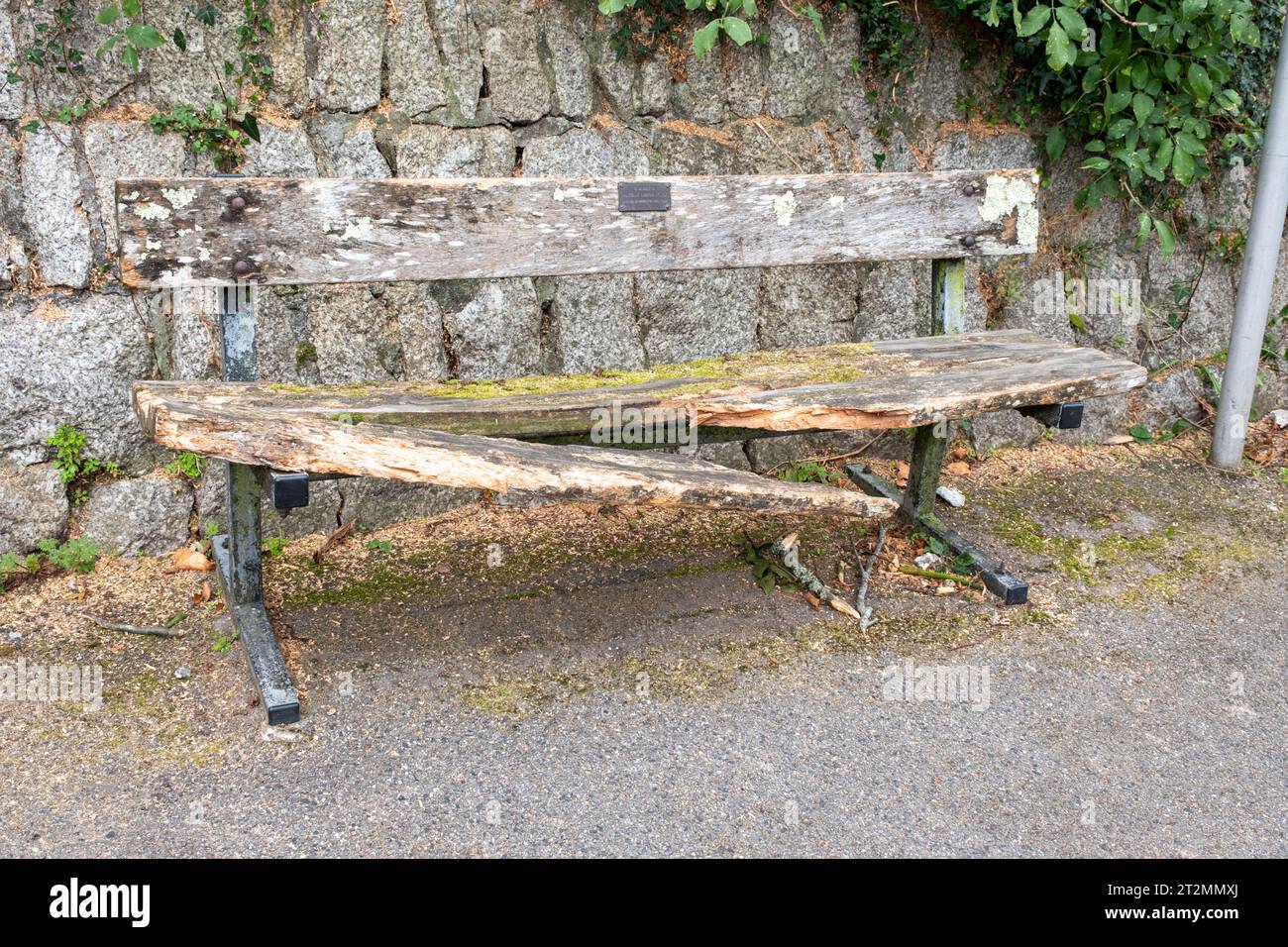 Broken wooden bench on the pavement Stock Photo - Alamy