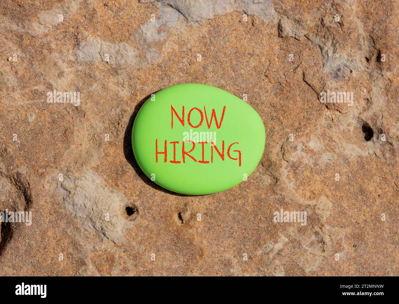 Now hiring symbol. Concept words Now hiring on beautiful green stone ...