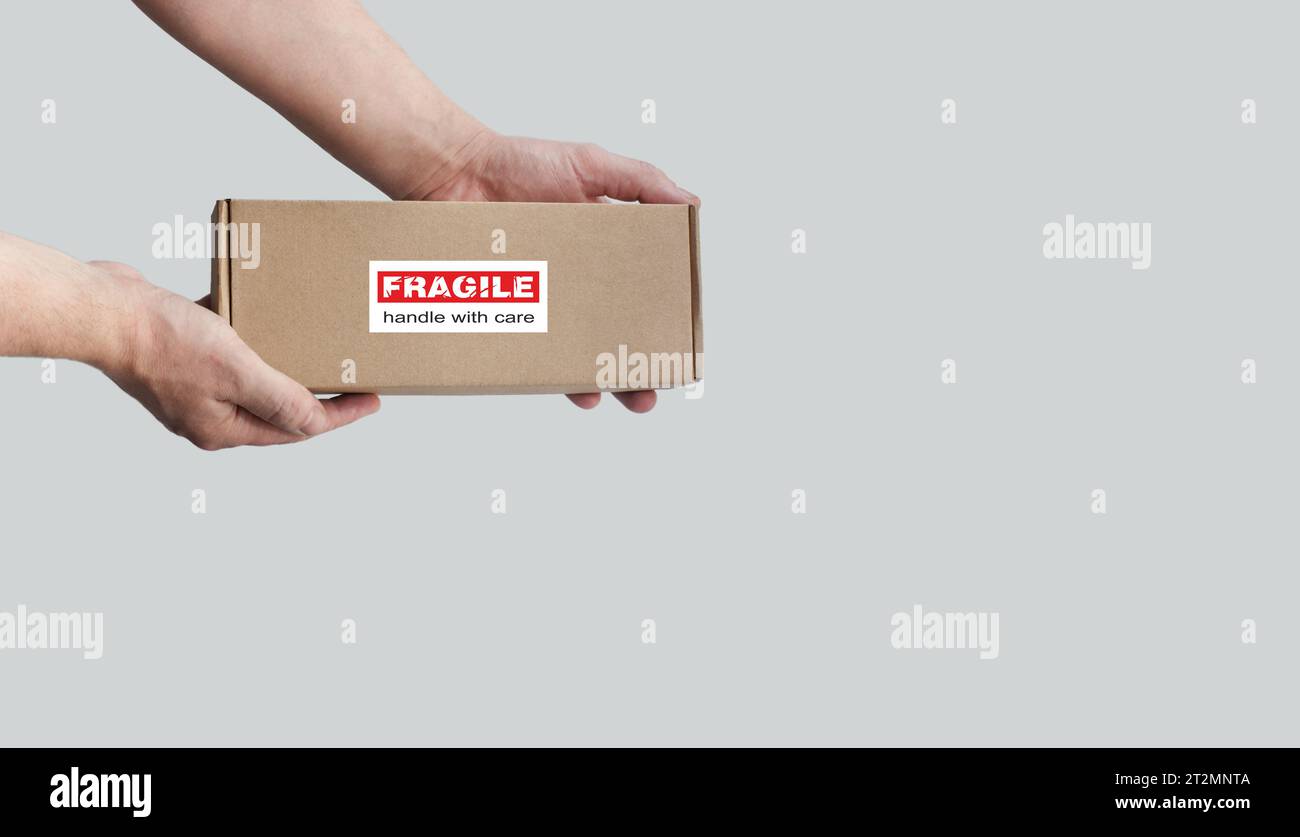 A rectangular cardboard box. Monochrome light background. An adhesive ...