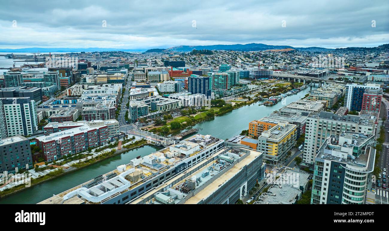 Aerial Mission Bay with city buildings and distant mountainous skyline ...