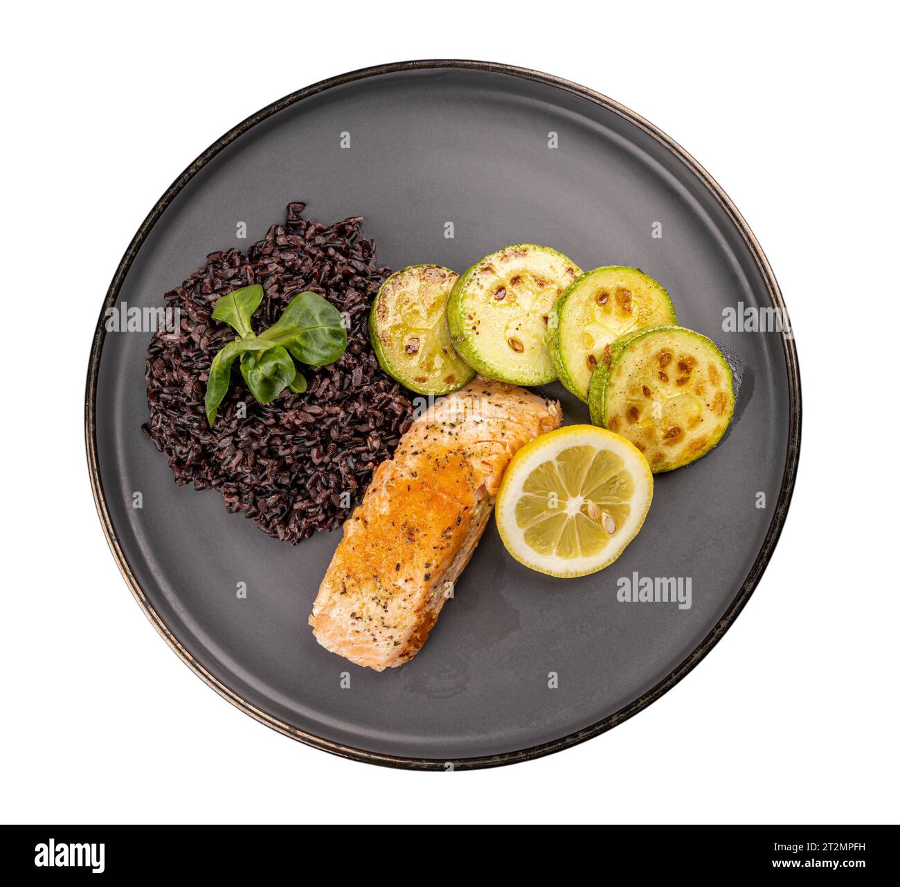 Roasted fish fillet served with wild rice and grilled zucchini Stock ...