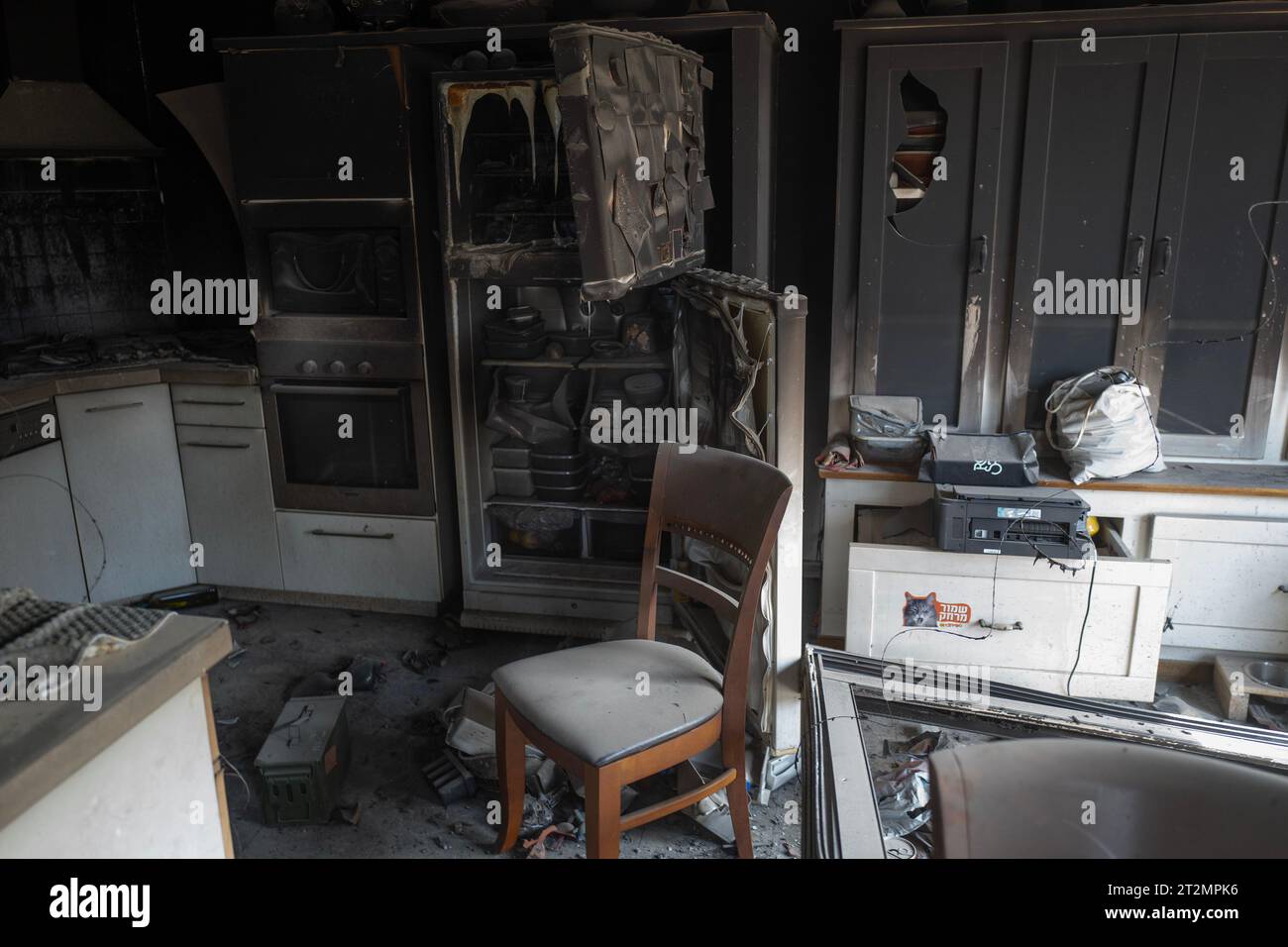 The interior of a burned out kitchen in a Jewish home in Kibbutz Be'eri ...