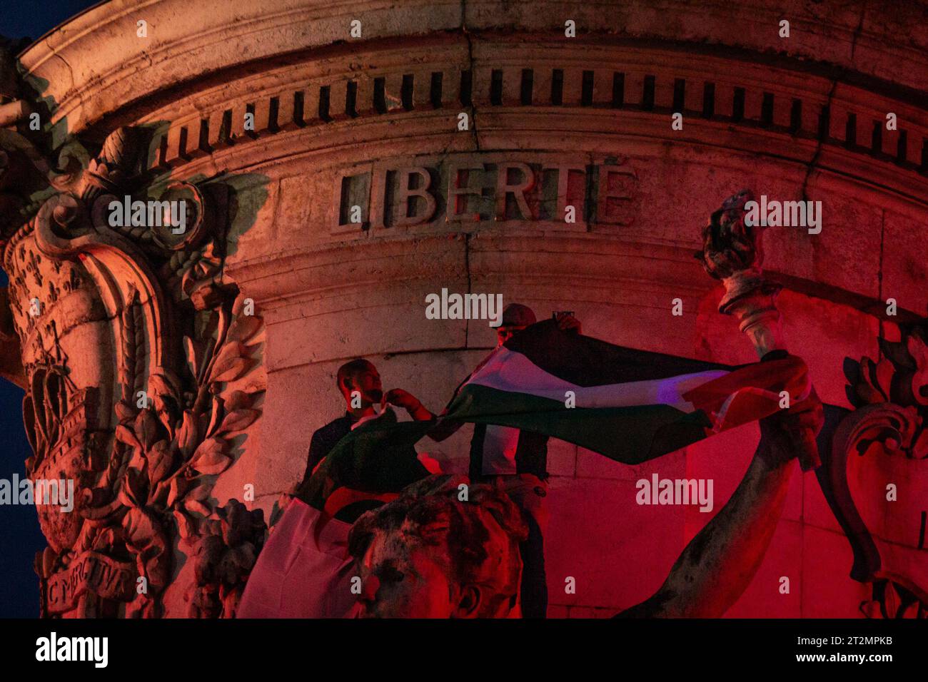 Protesters seen with a Palestinian flag at the Statue de la Republique ...