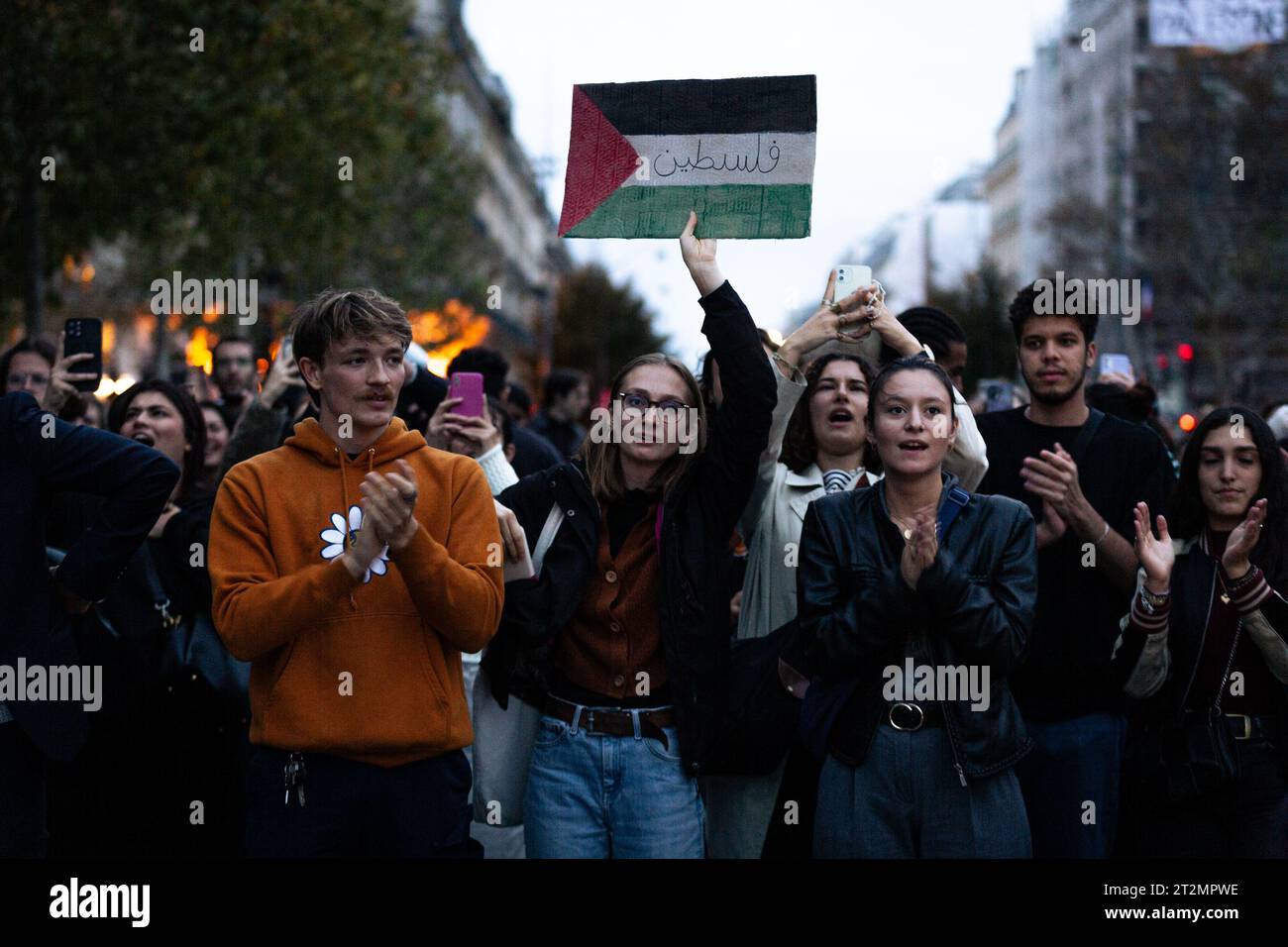 A protester holds a sign in colors of the Palestinian flag during the ...