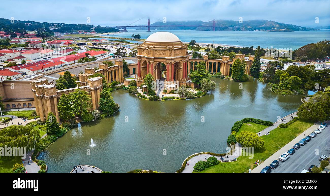 Palace of Fine Arts aerial with lagoon and distant Golden Gate Bridge ...